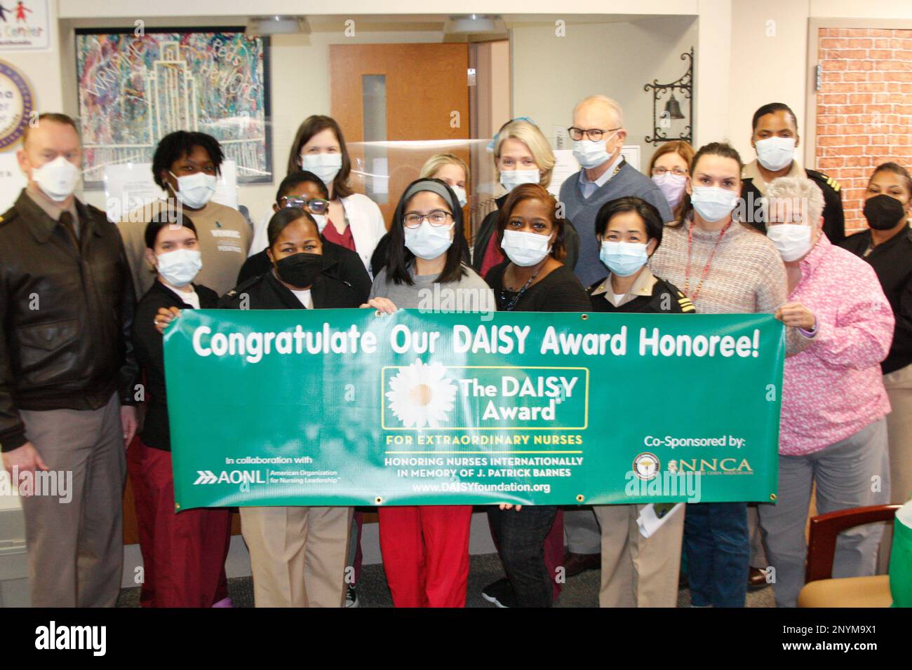 Colleagues of Shellina Campos (front center) celebrate her receiving ...