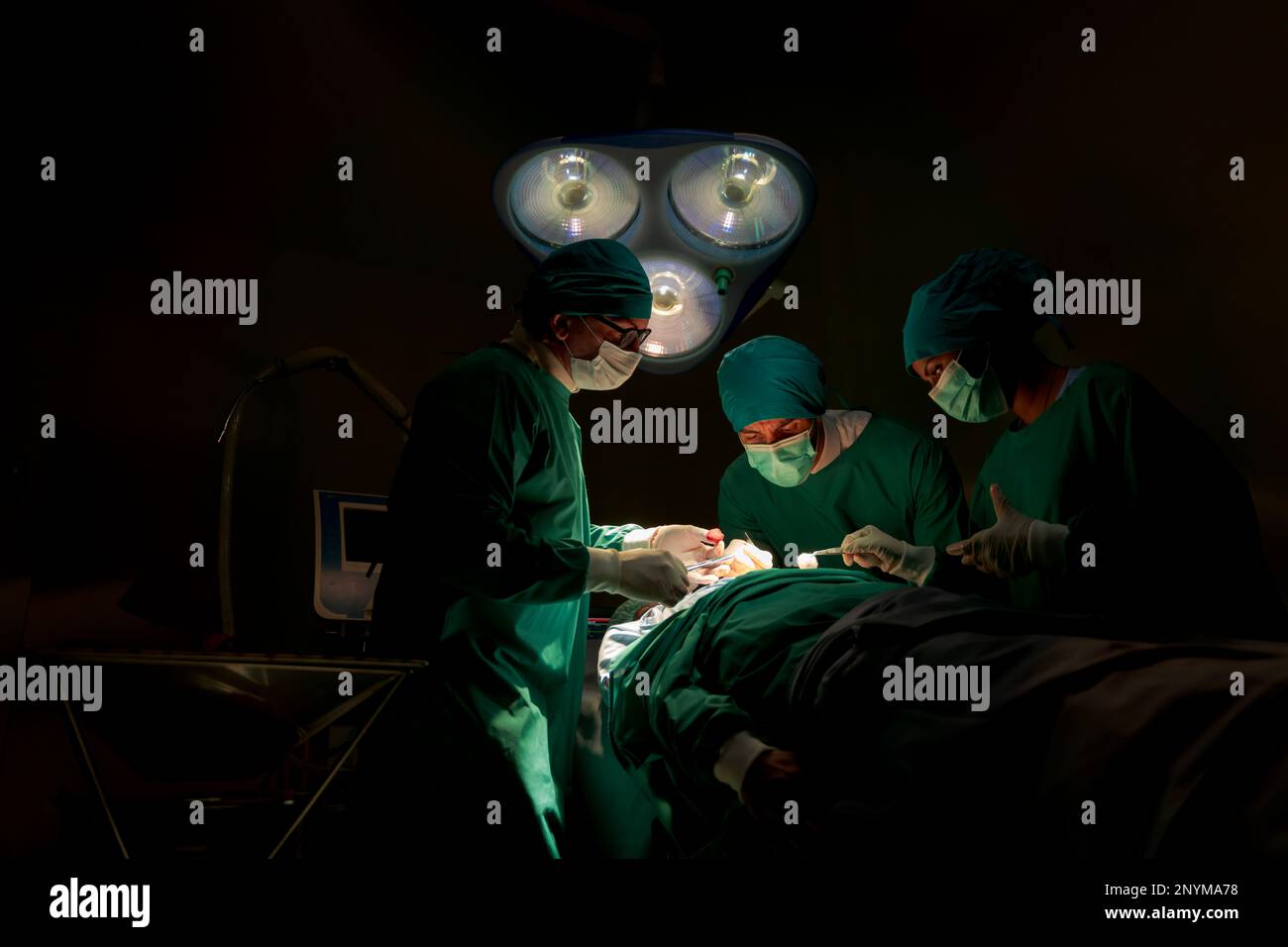 Team doctors operating room dressed green uniforms saving lives ...