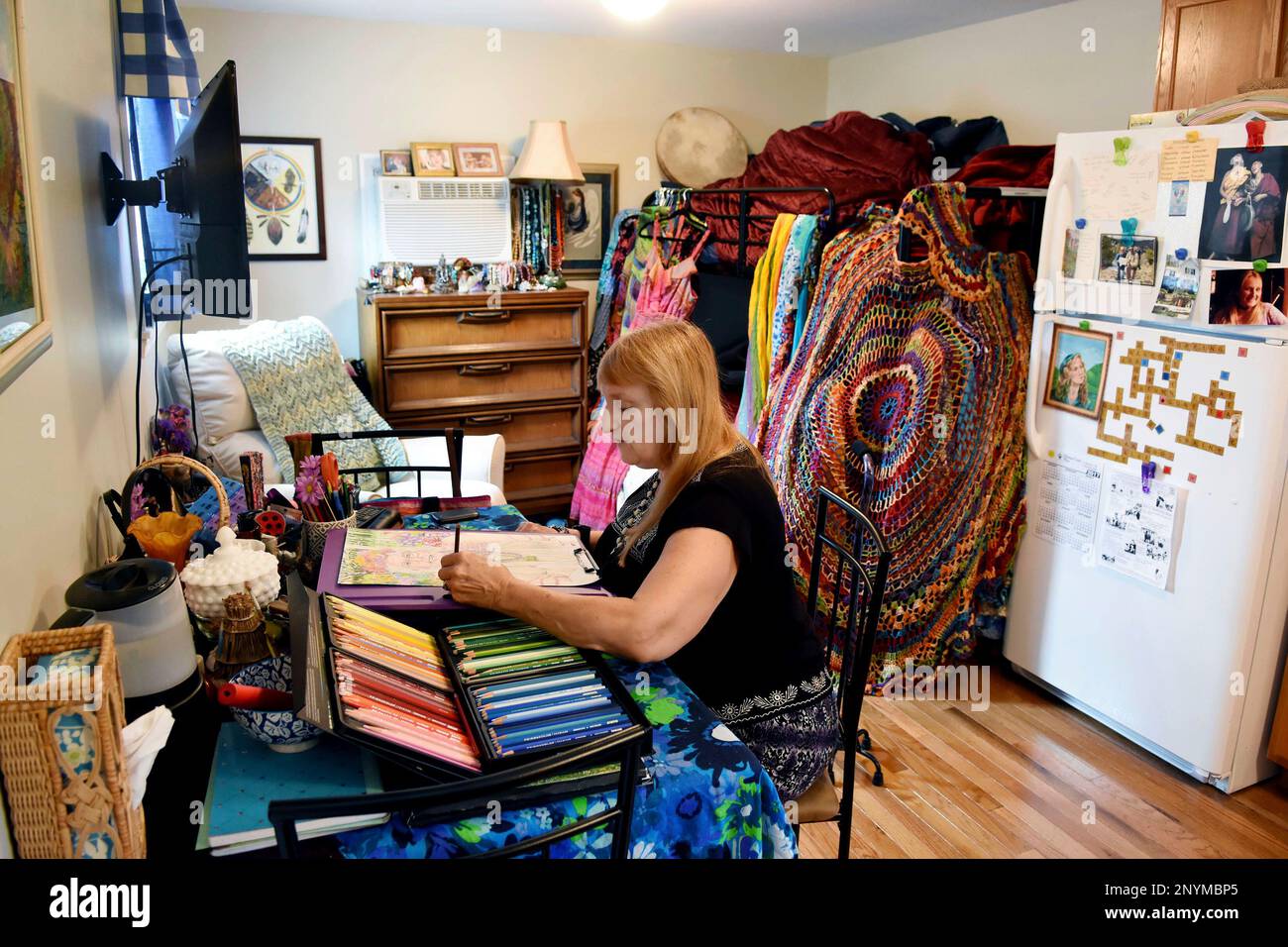 This June 20, 2017 images shows Deborah Dorland drawing in her ...