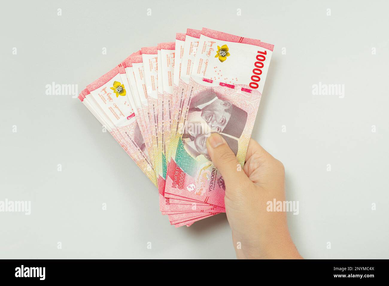 Cash payment concept. Indonesian rupiah currency (Rp. 100.000 Seratus ...
