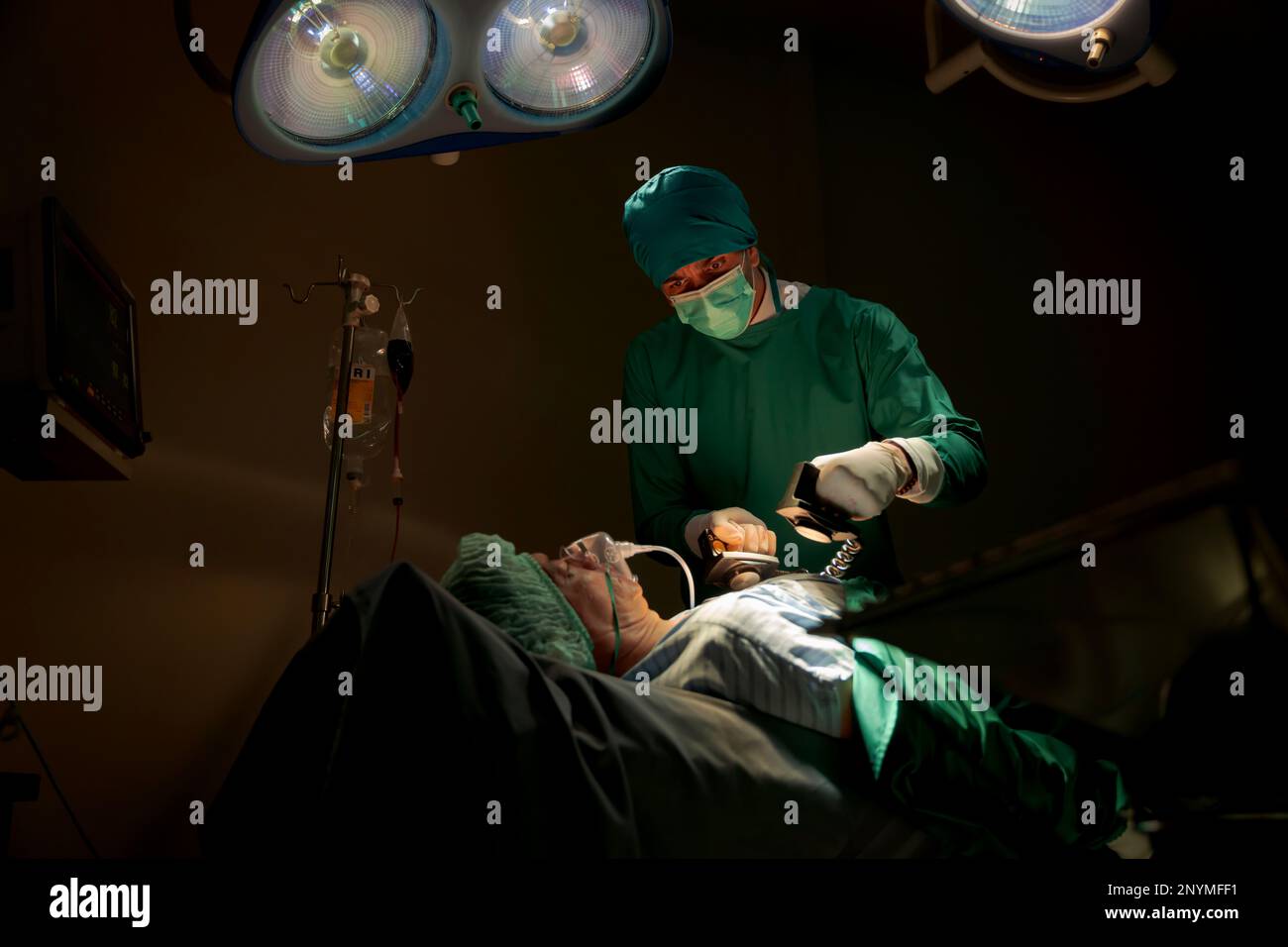Team doctors operating room dressed green uniforms saving lives ...
