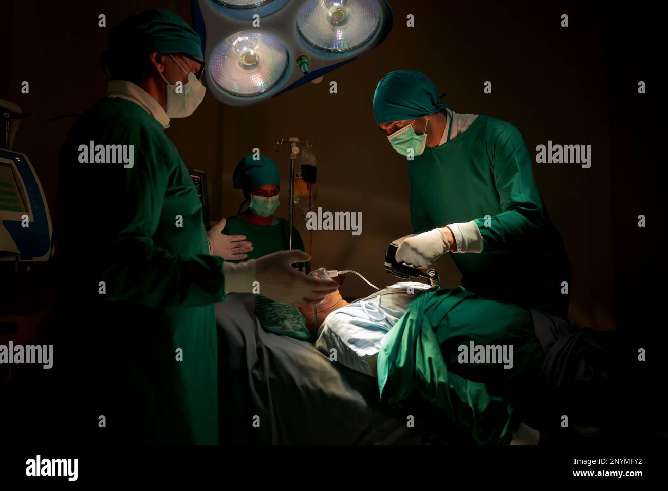 Team doctors operating room dressed green uniforms saving lives ...