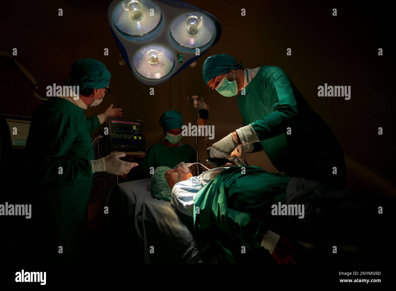 Team doctors operating room dressed green uniforms saving lives ...