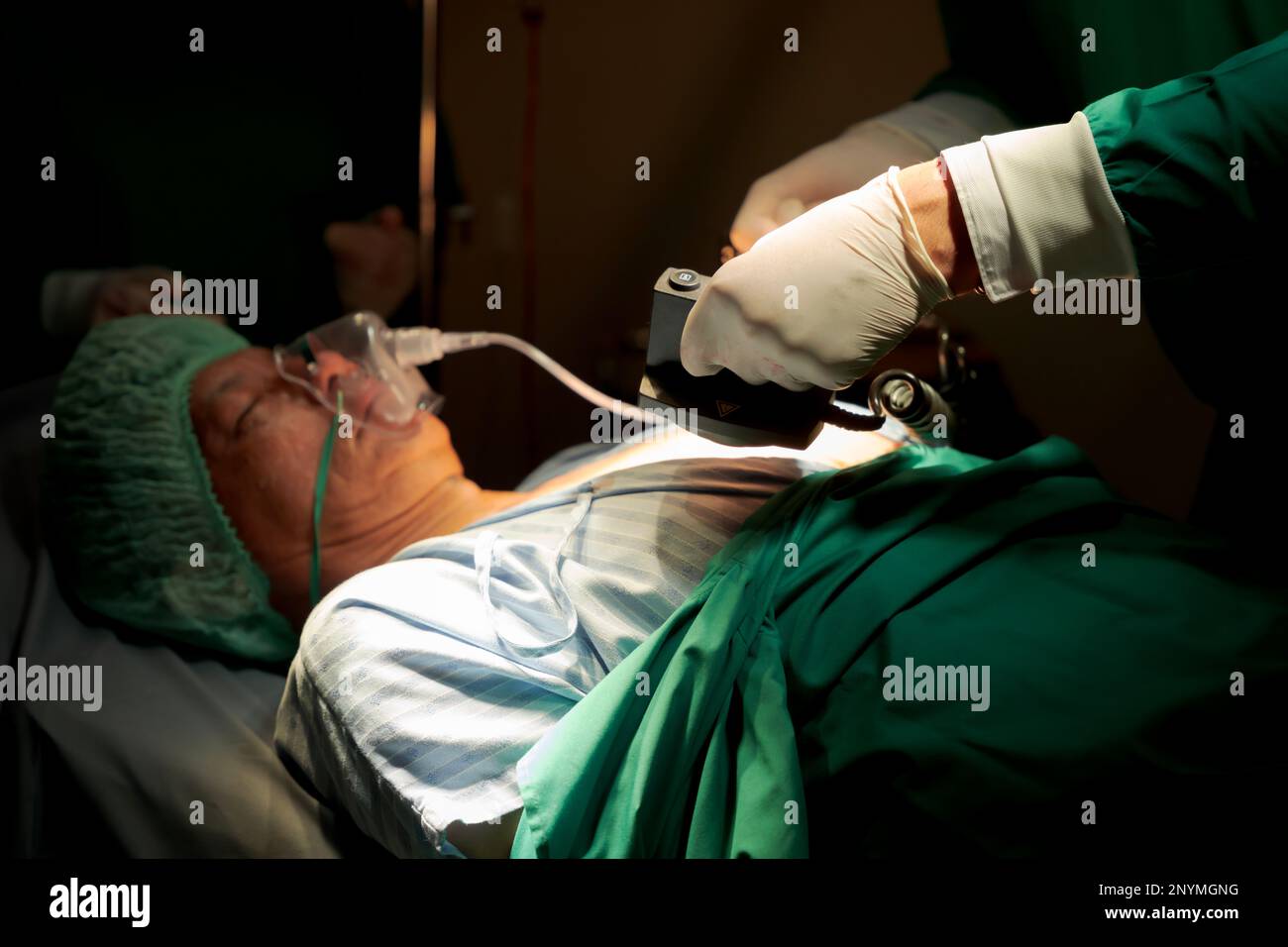 Team doctors operating room dressed green uniforms saving lives ...