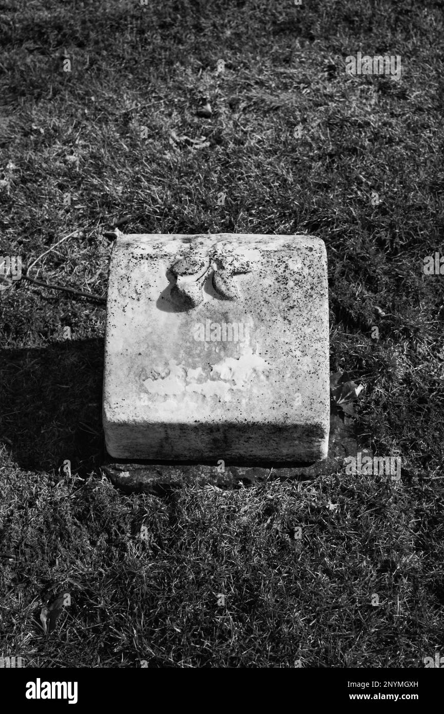 A vintage traditional stone gravestone with a blank epithet and room ...