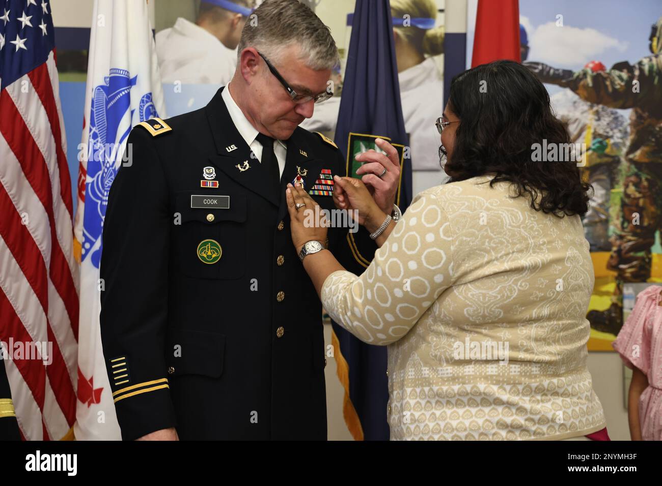 Linda Amarsingh (right) pins the retirement pin on her husband Maj ...