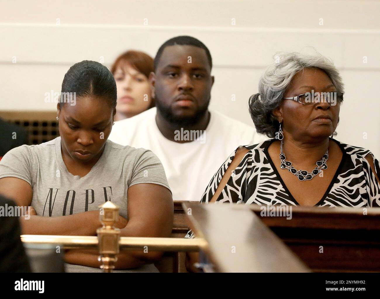 Audrey DuBose, right, mother of Sam DuBose, looks at the jury as ...