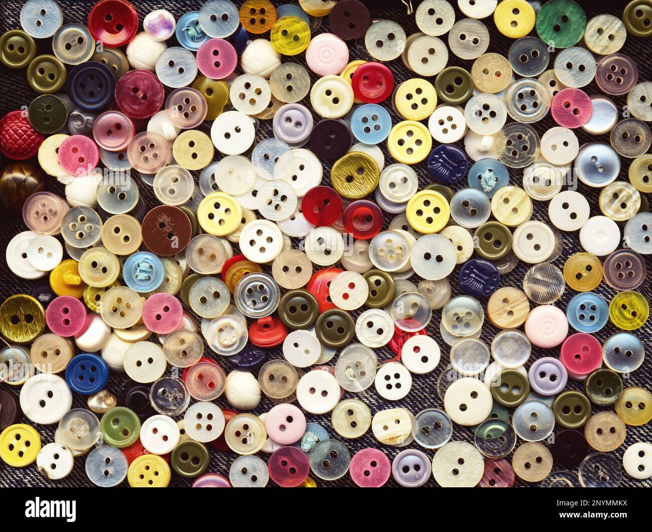 Lot of colorful plastic clothing buttons. Many small round vintage ...