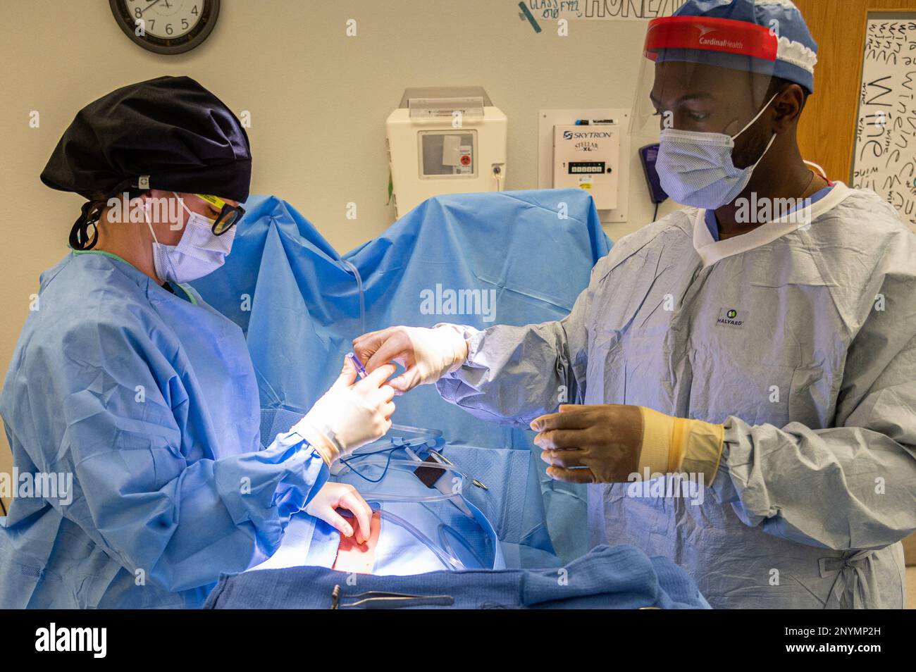 Instructors act as surgeons during a mock surgery while 68D operating ...