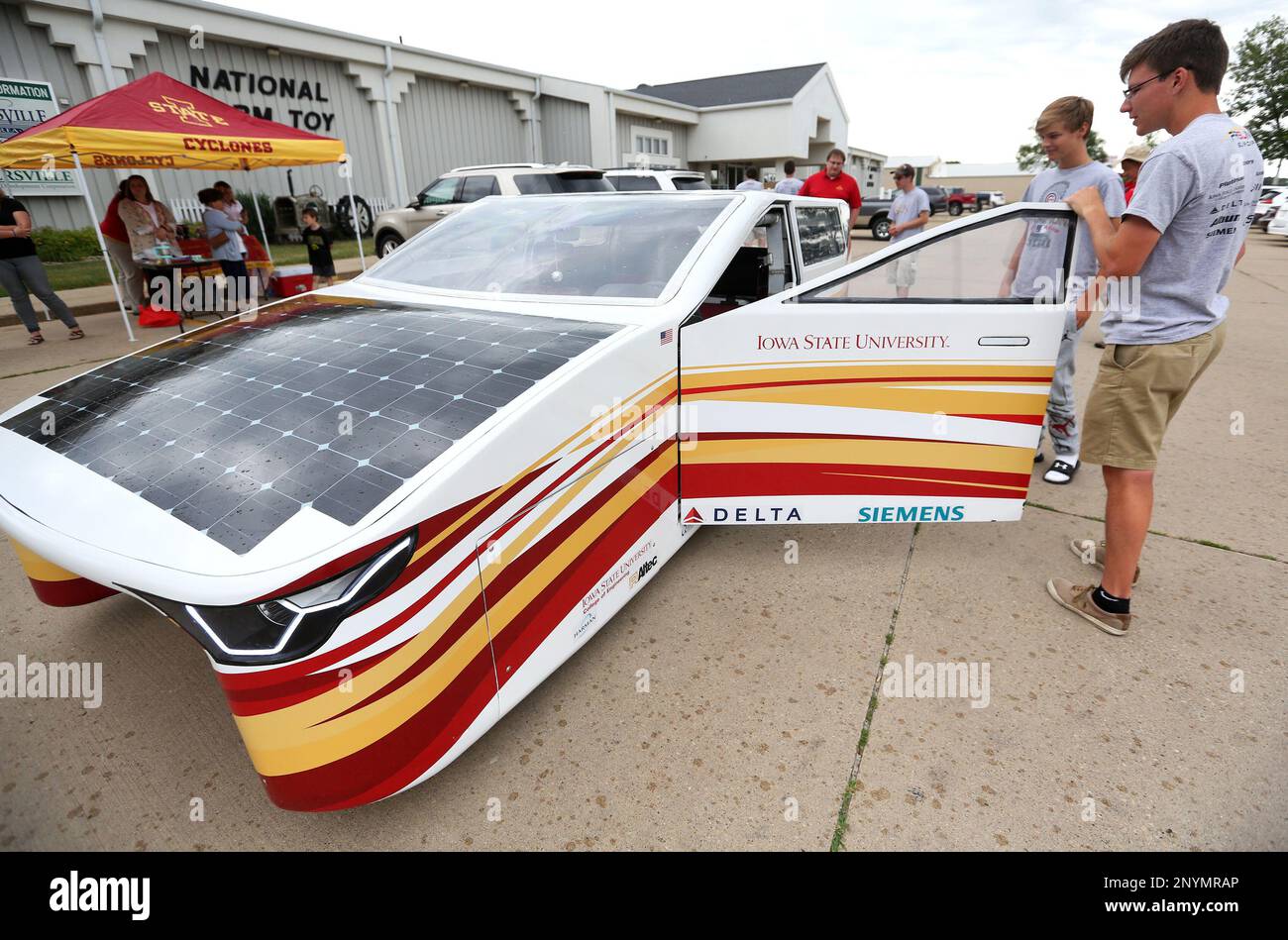 Iowa State University student Brandon Steffensmeier, far right, talks ...