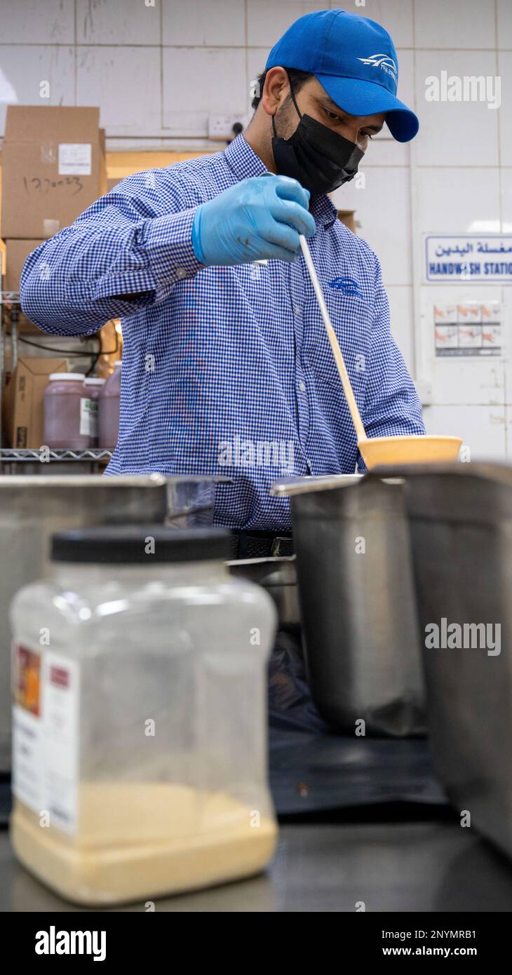 Zulfikar Ali, The Bridge Co. contractor, makes sauce at the Desert ...