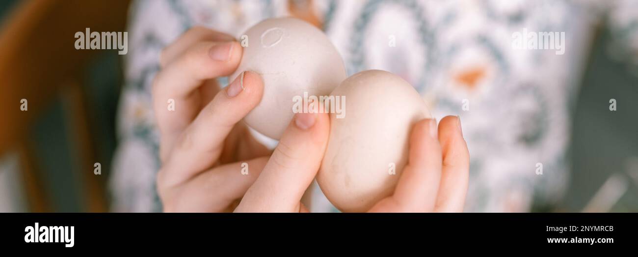 easter holiday time in spring season. traditional children hands are ...