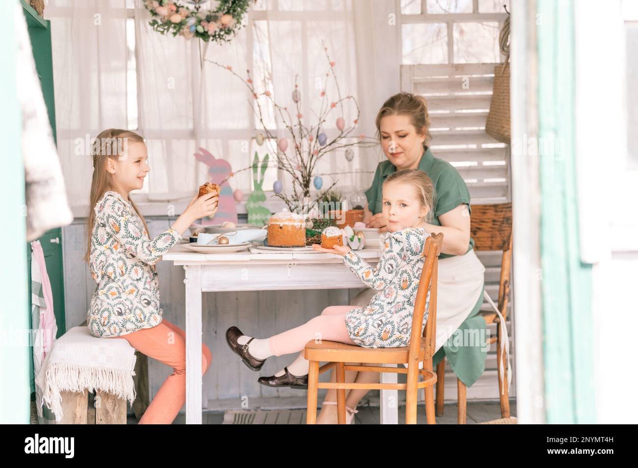 easter holiday time in spring season. happy family candid little kids ...