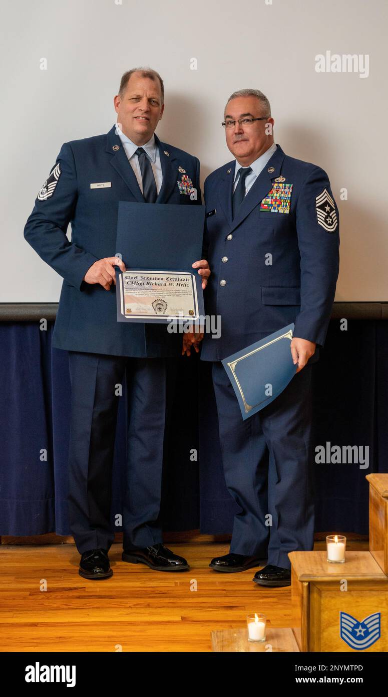 Chief Master Sgt. Rich Hritz, left, is presented a certificate from ...