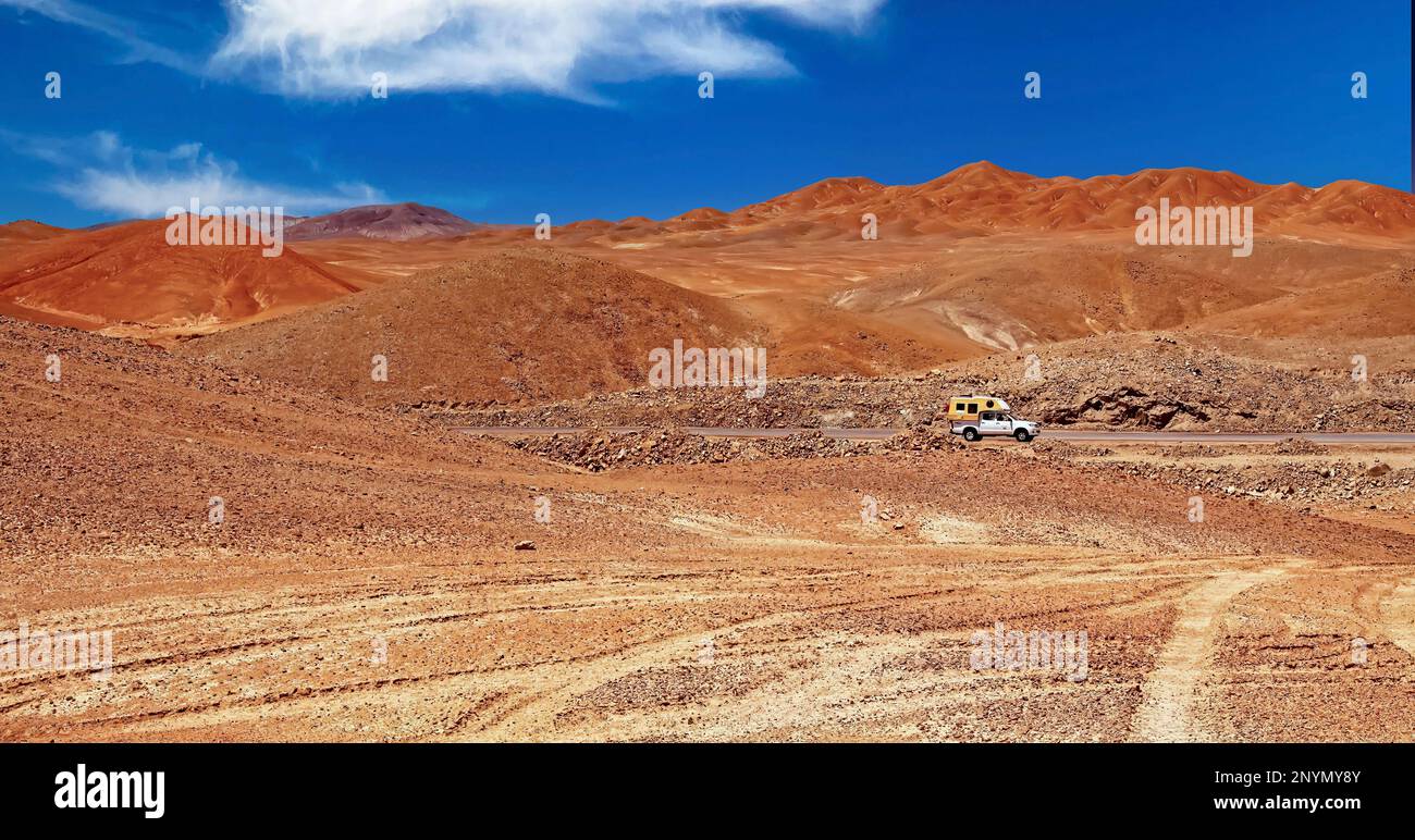 Red sandy dry arid barren valley, off road tire tracks in sand, camper ...