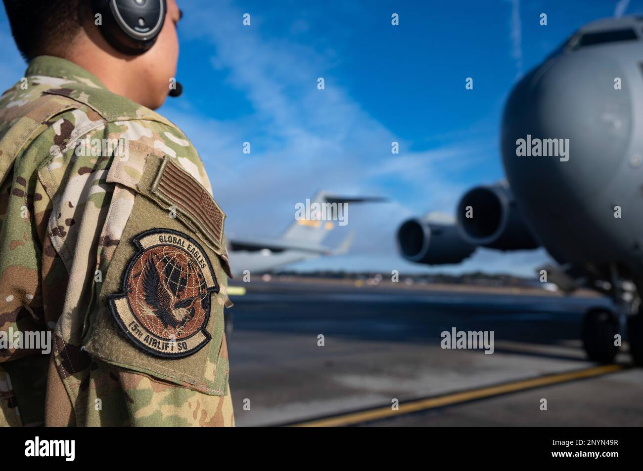 U.S. Air Force Senior Airman Virgilio Frial, a loadmaster with the 15th ...