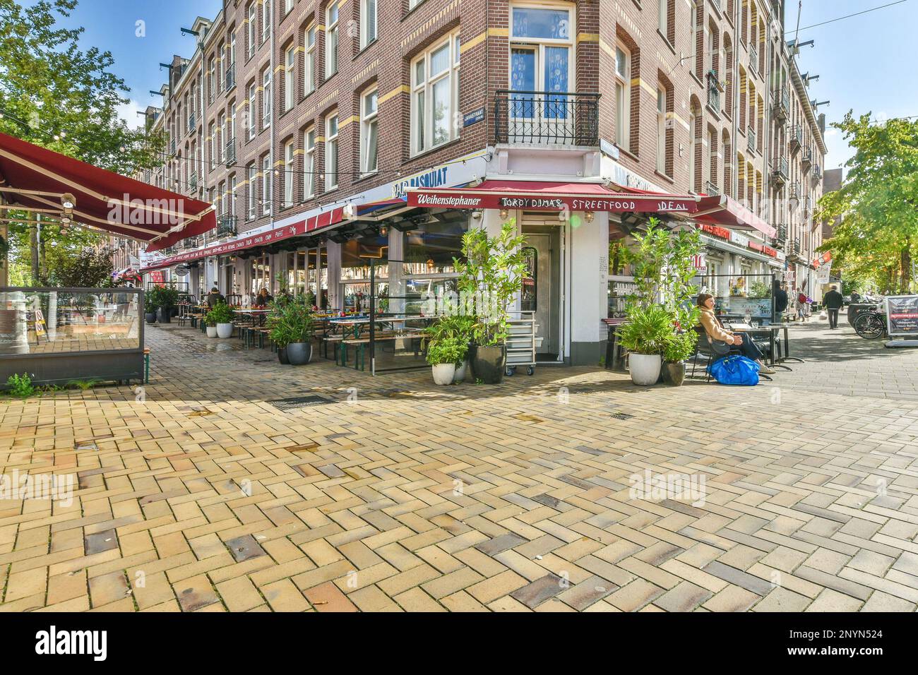 Amsterdam, Netherlands - 10 April, 2021: an outdoor cafe with people ...