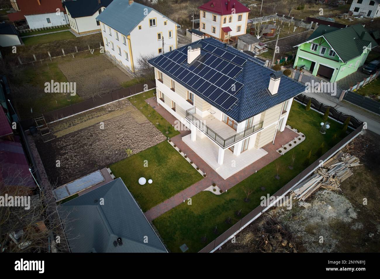 Aerial drone view of autonomous house with photovoltaic solar panels on ...