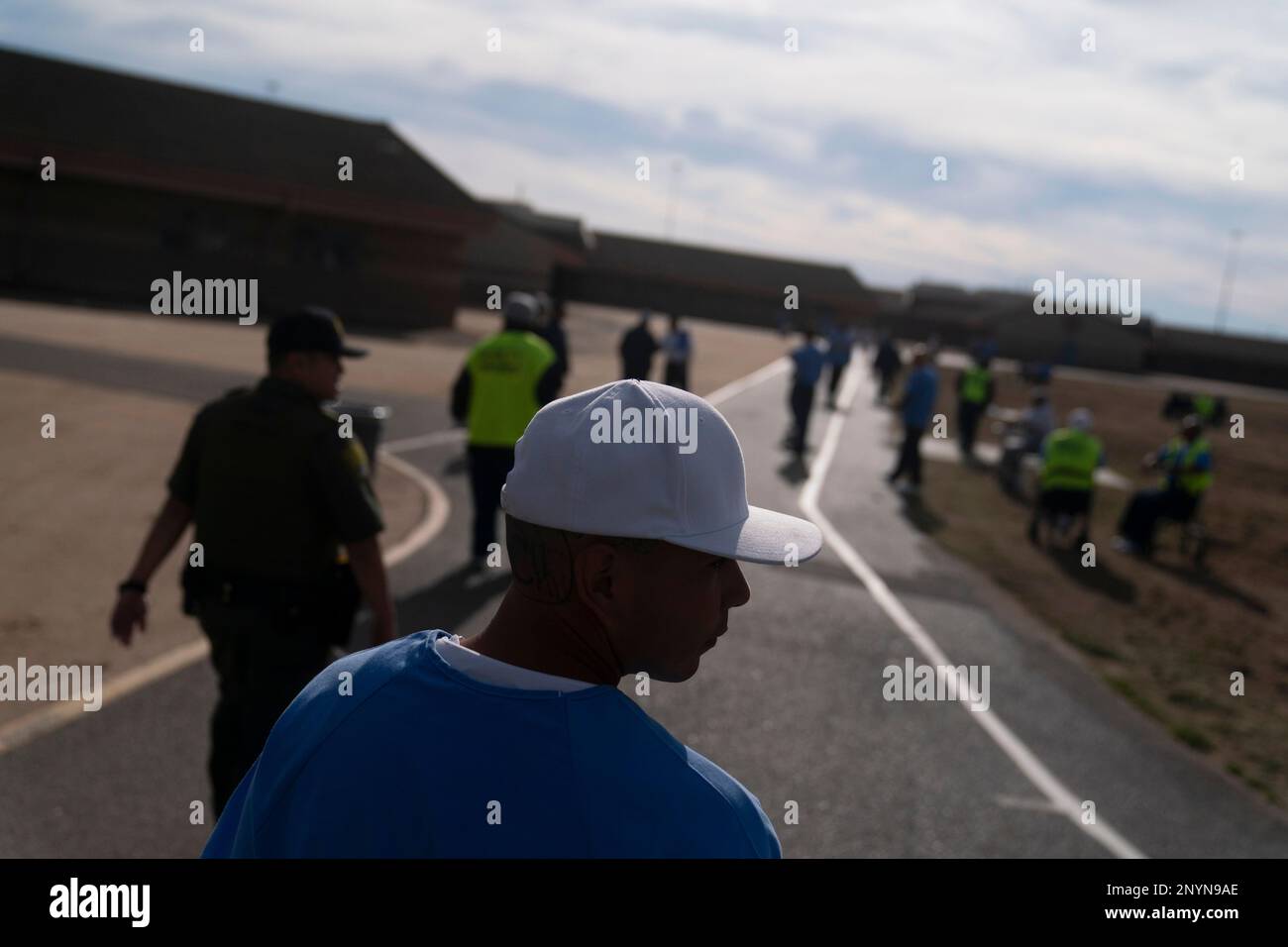 Joseph Sena walks across a prison yard at Valley State Prison in ...