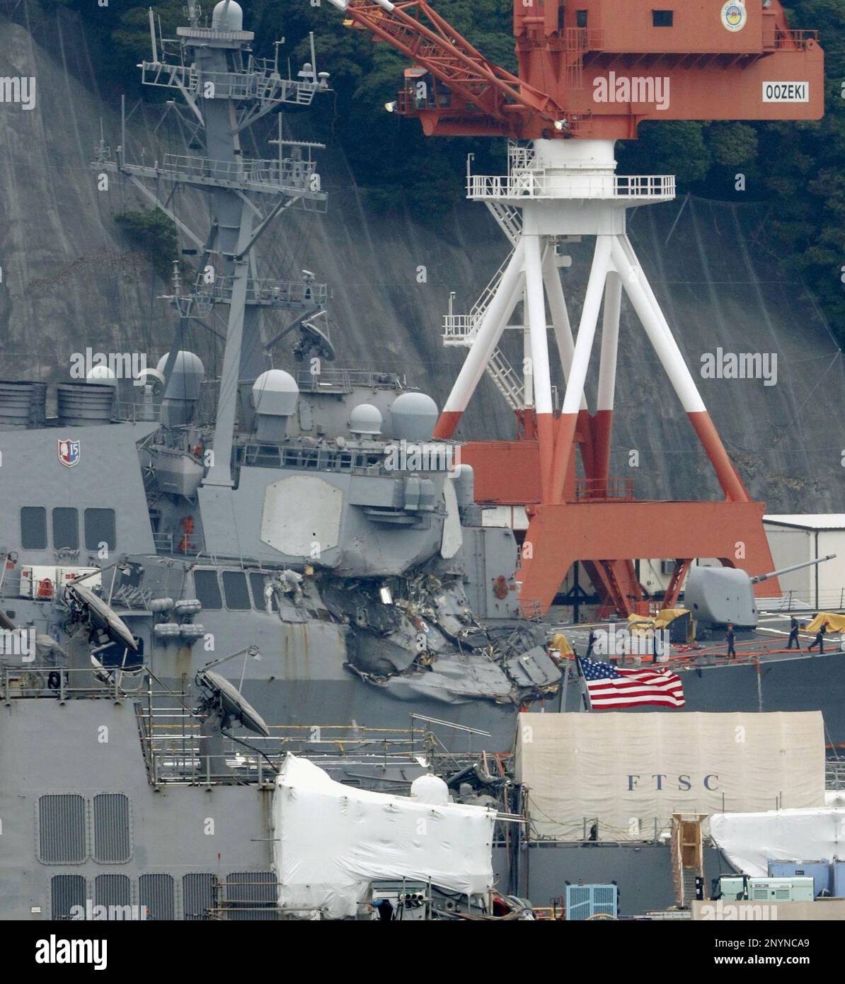 Damaged USS Fitzgerald is seen at Yokosuka Naval Base, south of Tokyo ...