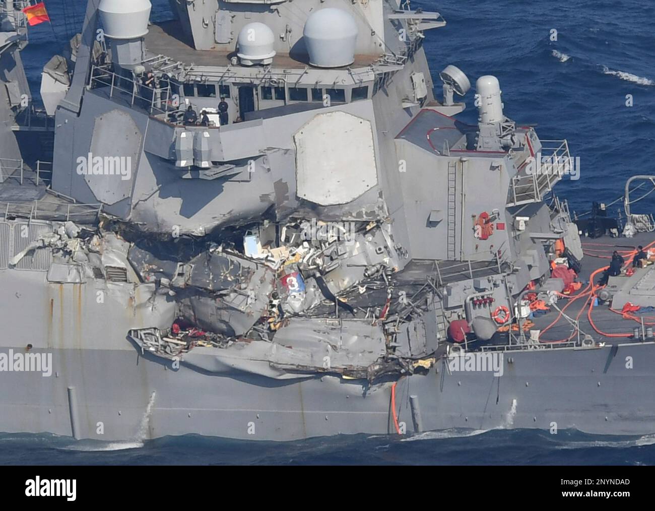 An aerial photo shows the USS Fitzgerald that is damaged by the ...