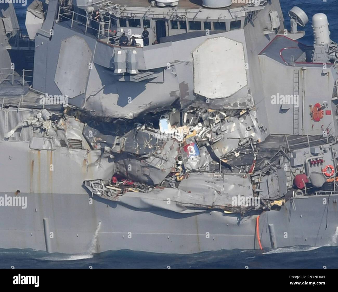 An aerial photo shows the USS Fitzgerald that is damaged by the ...