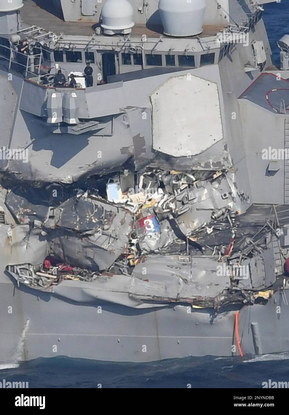 An aerial photo shows the USS Fitzgerald that is damaged by the ...