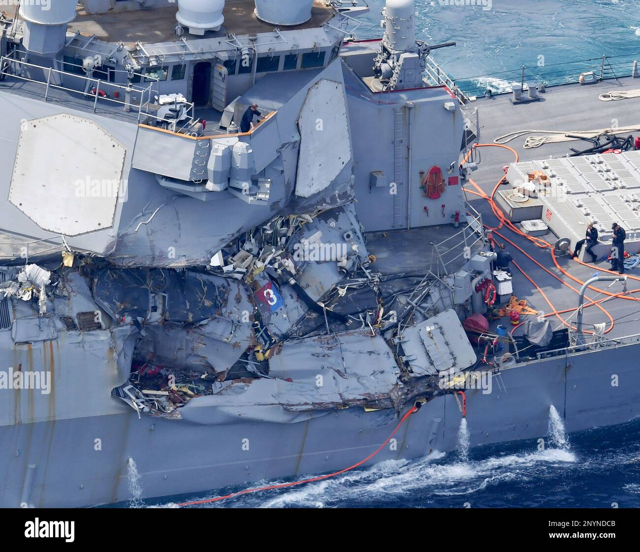 An aerial photo shows the USS Fitzgerald that is damaged by the ...