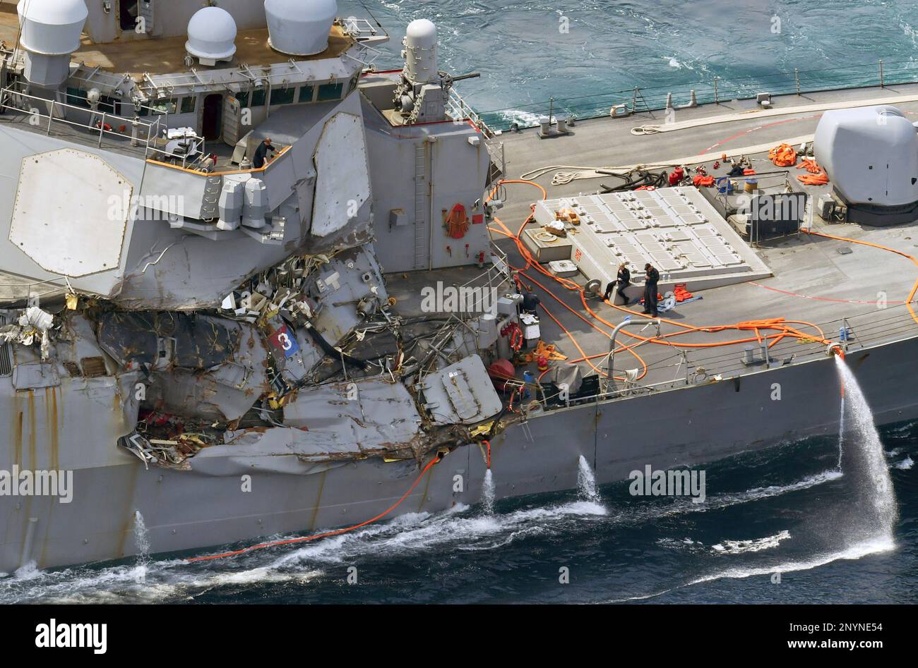 This aerial photo shows the USS Fitzgerald heading for Yokosuka naval ...