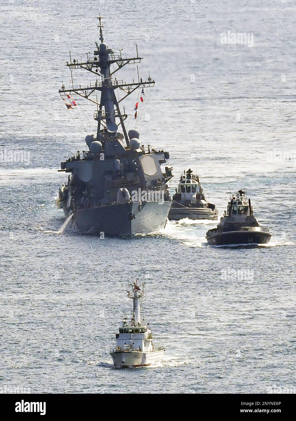 This aerial photo shows the USS Fitzgerald (8,315t) heading for ...