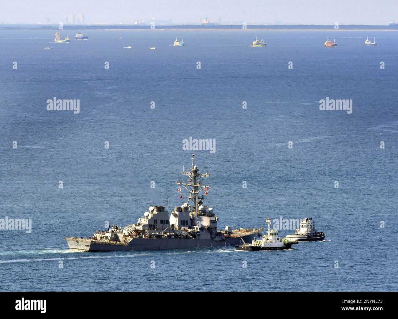 This aerial photo shows the USS Fitzgerald (8,315t) heading for ...
