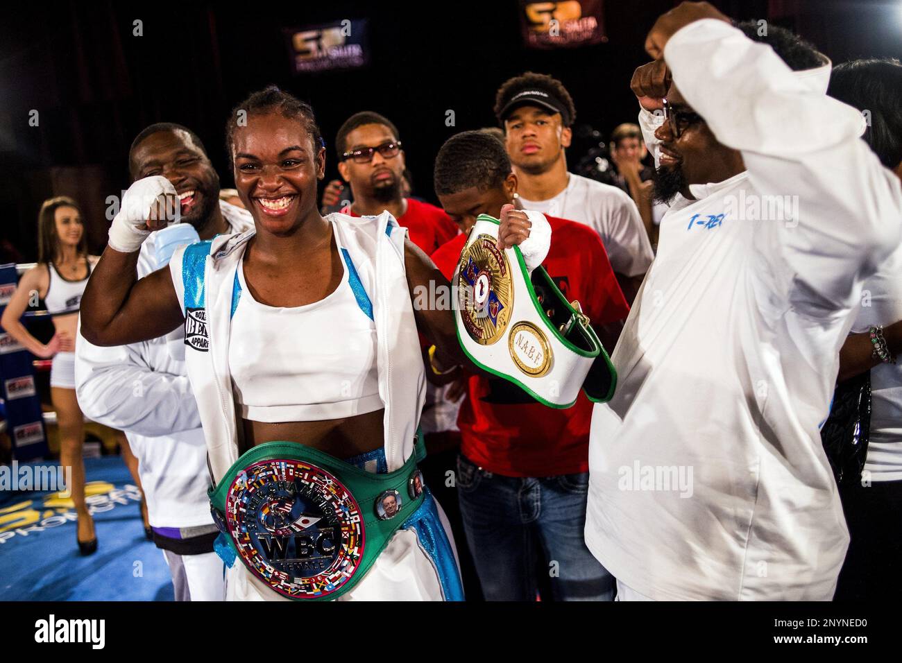 Claressa Shields flexes her muscles as she smiles out toward her family ...
