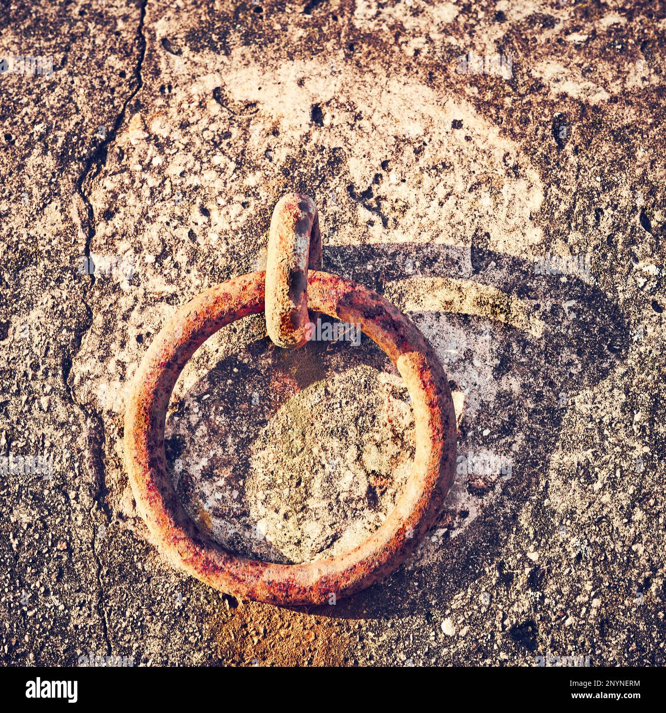 Rusty ring on seawall Stock Photo - Alamy