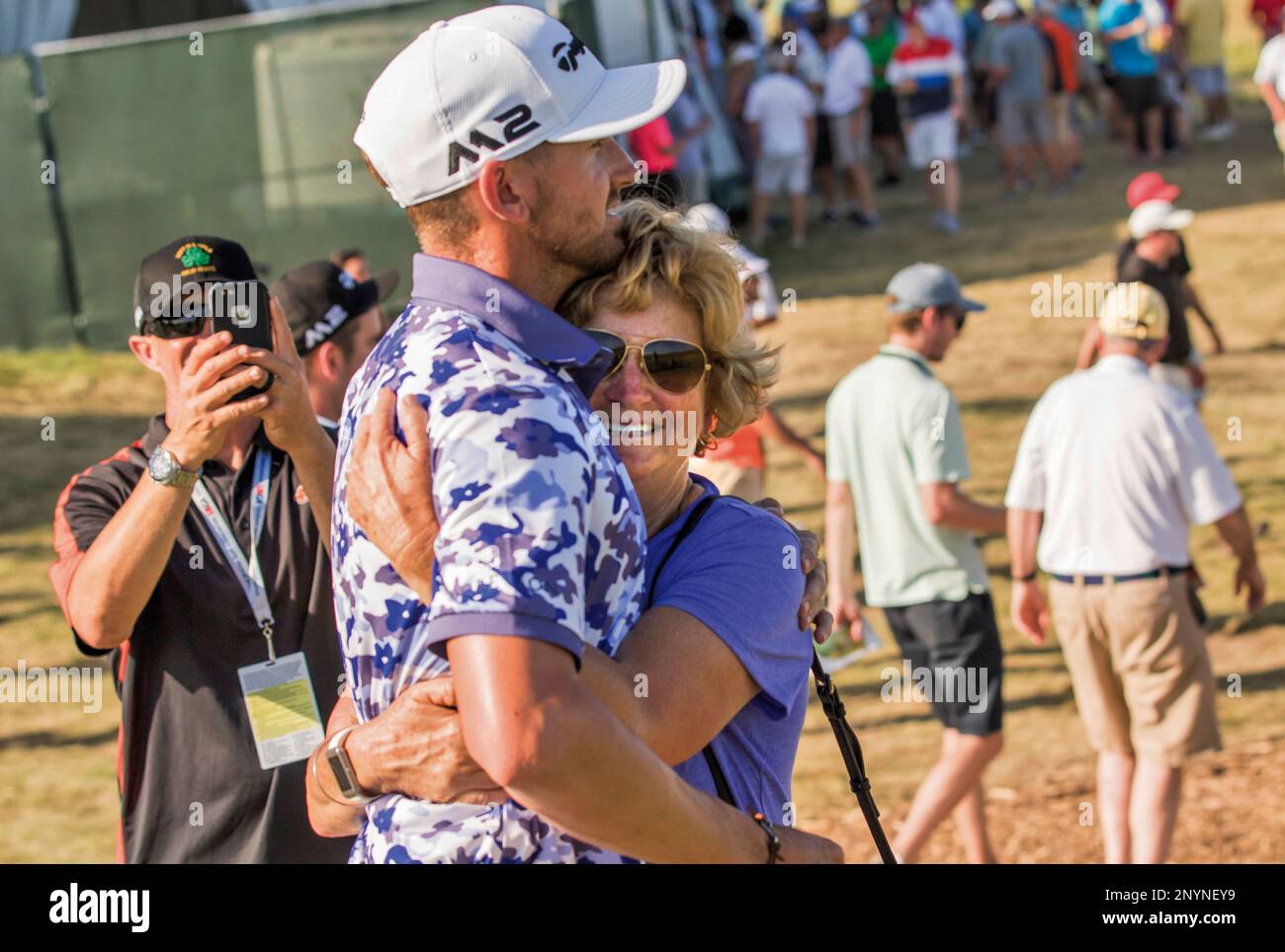 Paula Dougherty of Murrieta, Calif., hugs her son Kevin after he ...