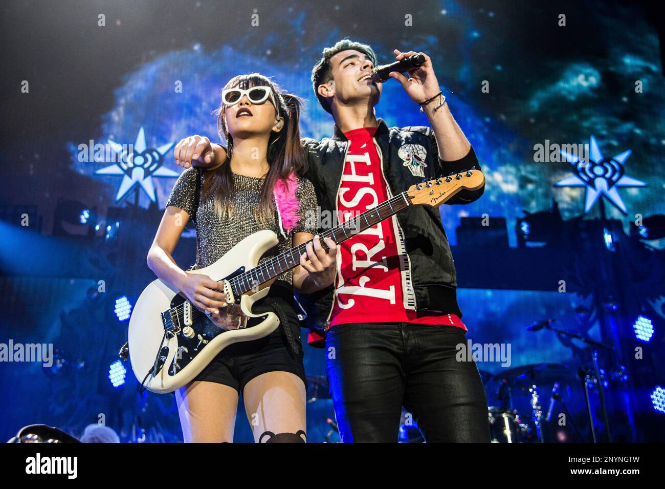JinJoo Lee and Joe Jonas of DNCE perform during 103.5 KISS FM's Jingle Ball 2015 at Allstate ...