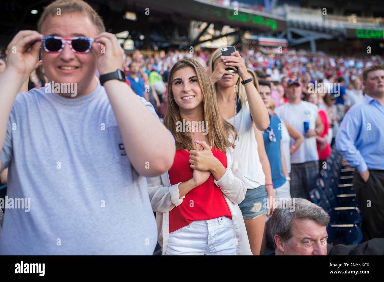 UNITED STATES - JUNE 15: Fans listen to a message from President Donald ...