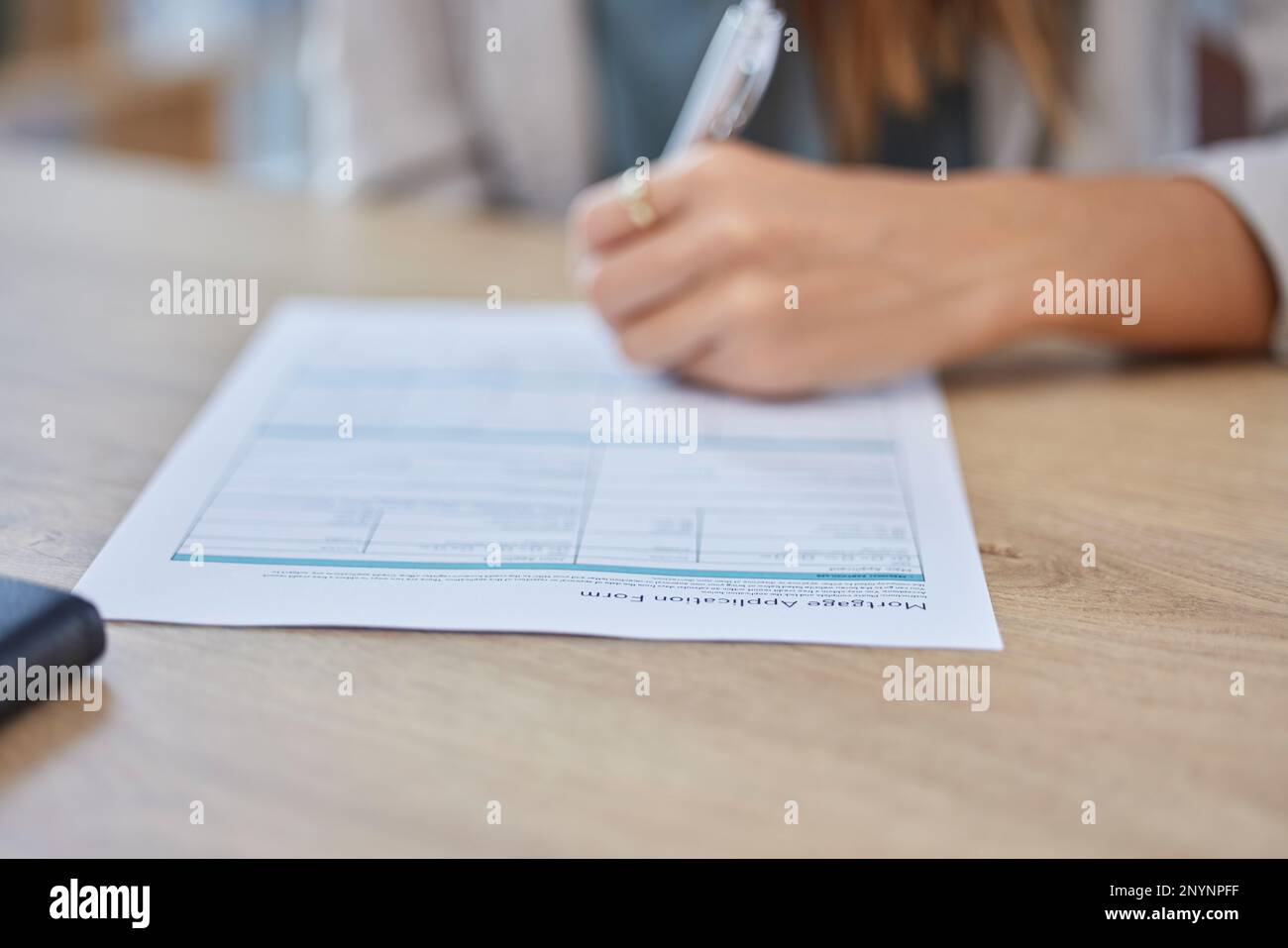 Mortgage application, signature and woman hands for loan agreement ...