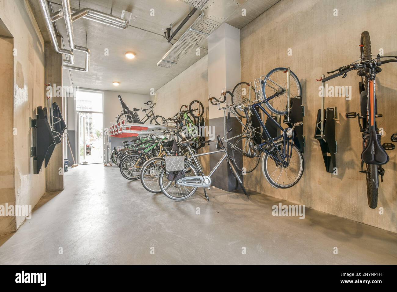 Amsterdam, Netherlands - 10 April, 2021: some bikes hanging on the wall ...