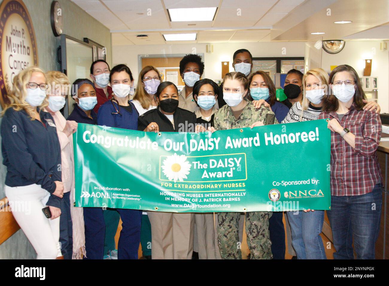 Colleagues and family of Navy Ensign Natalie Aragon (fifth from right ...