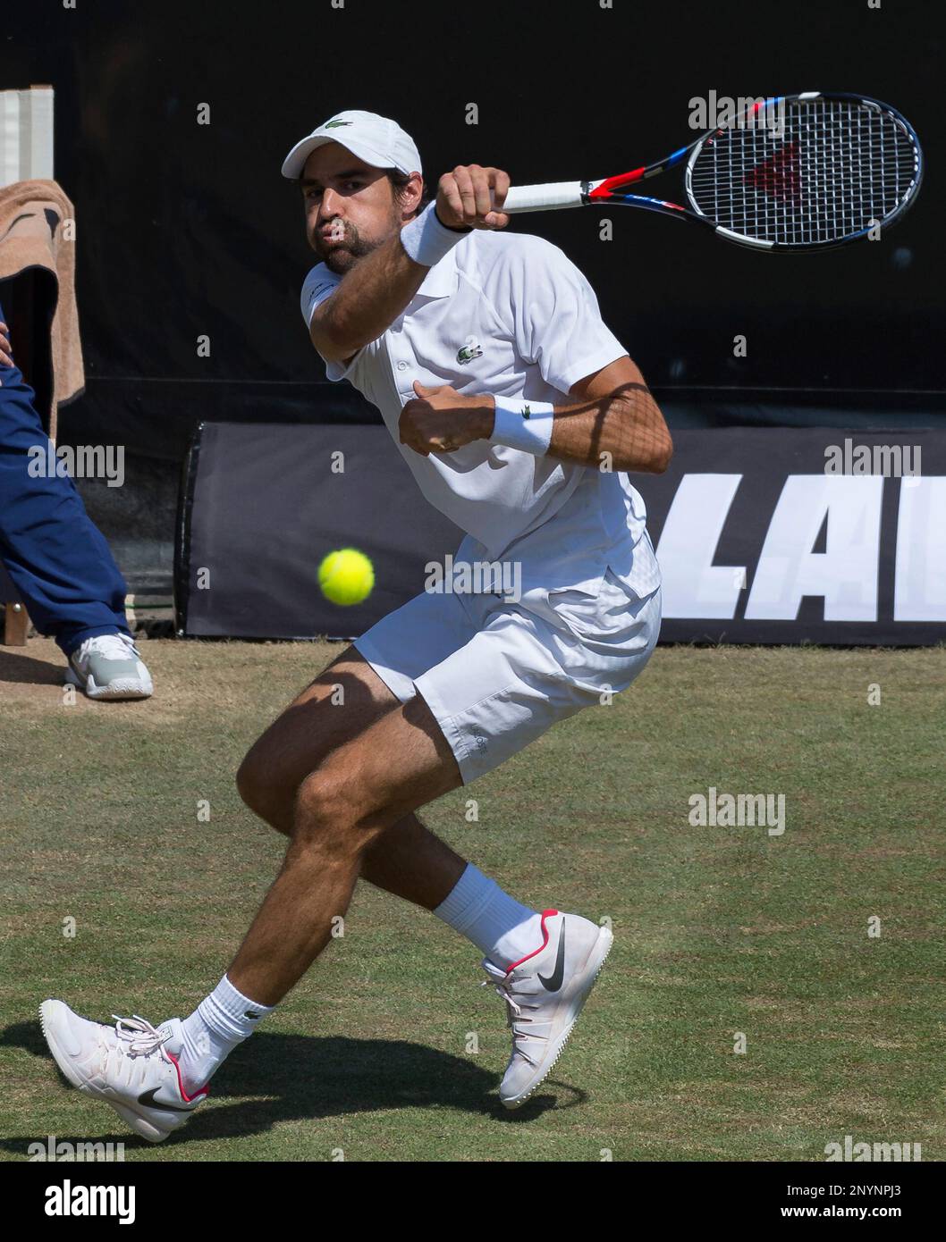 Jeremy Chardy of France returns a ball to Feliciano Lopez of Spain ...