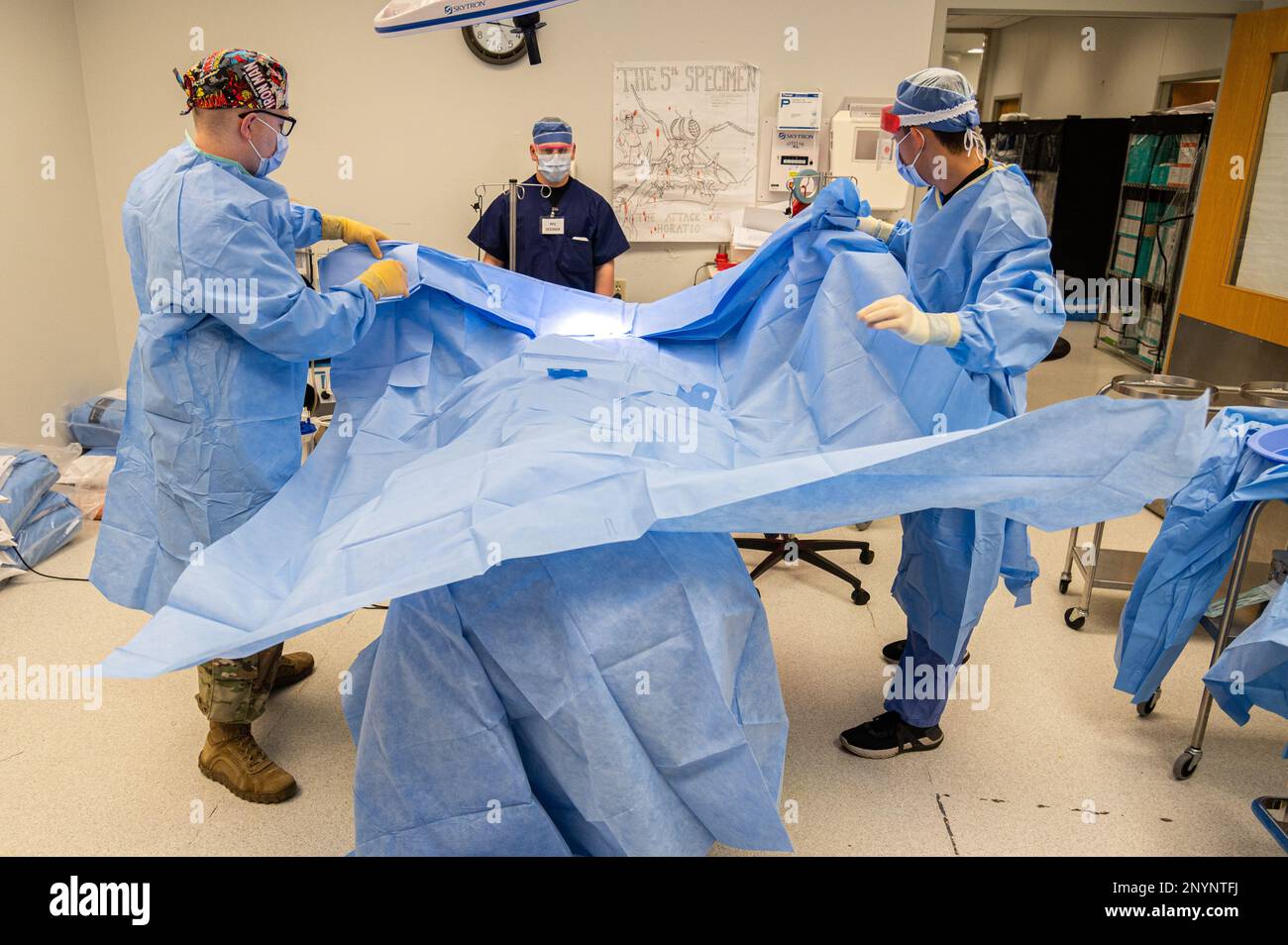Instructors act as surgeons during a mock surgery while 68D operating ...