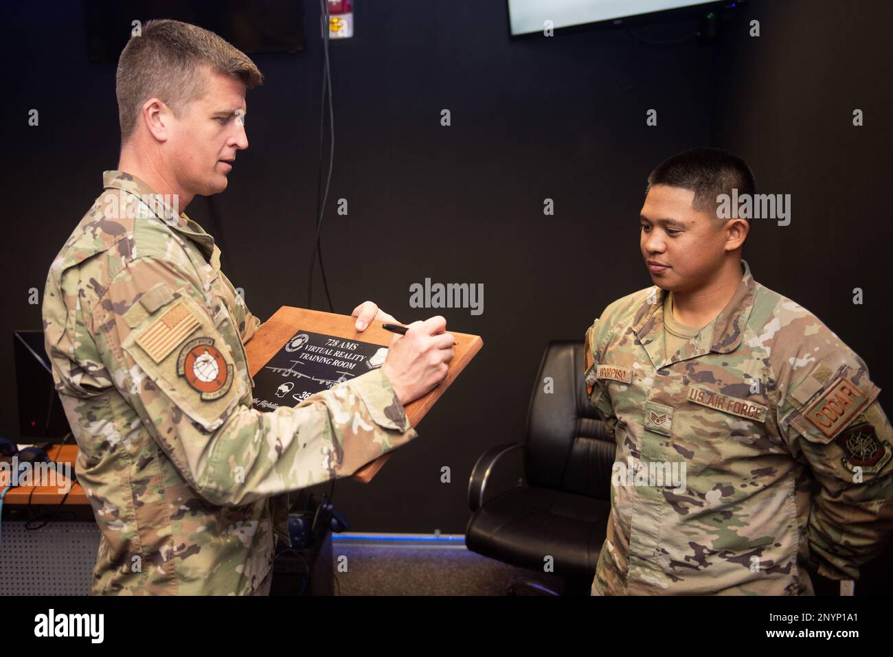 Lt. Col. Matthew Bryan, left, 728th Air Mobility Squadron commander ...