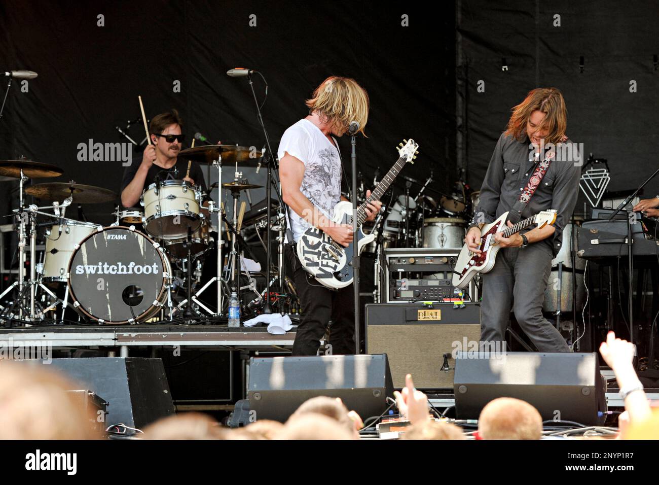 Chad Butler, Jon Foreman, and Drew Shirley of Switchfoot perform during ...