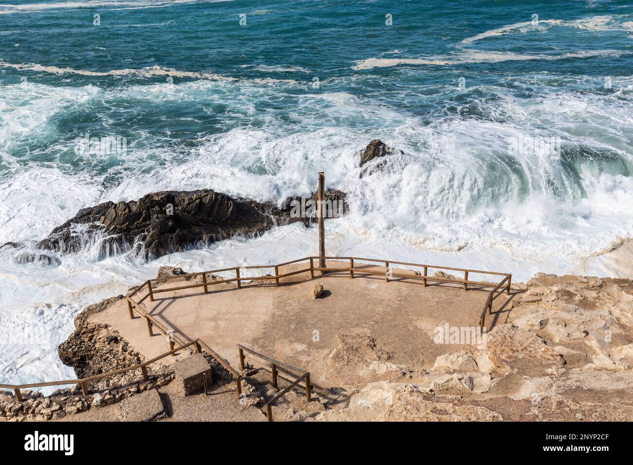 Sea foam covering the reefs on which a big wave has just crashed. Ajuy ...