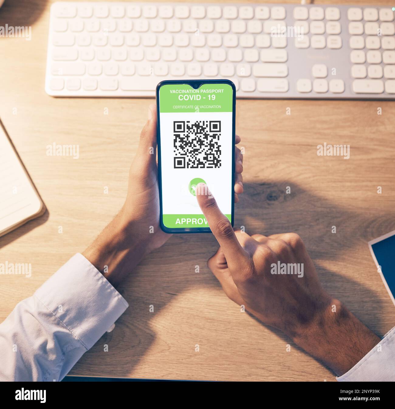 Hands, phone and QR code of covid vaccination for online passport ...