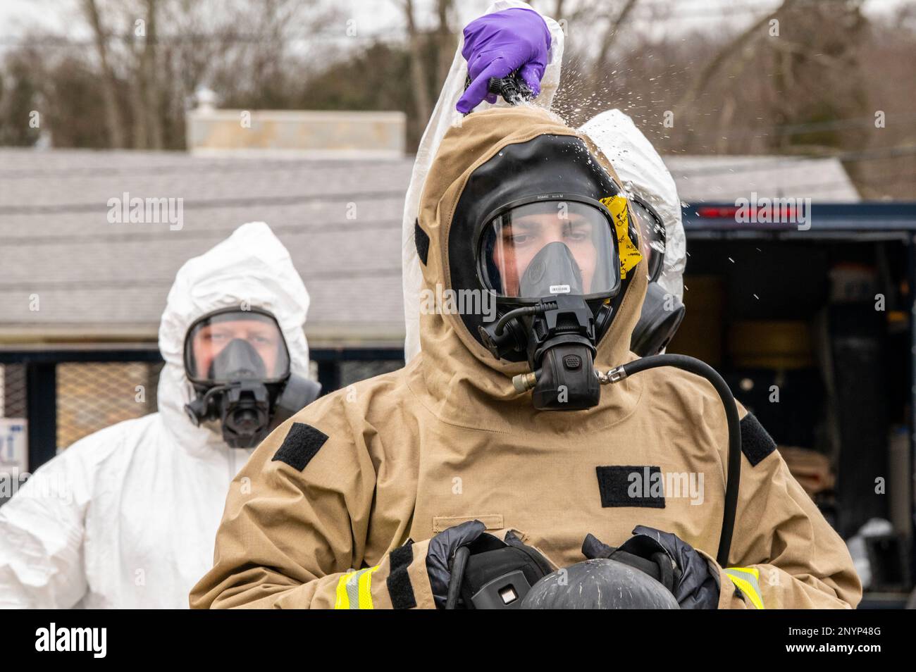 Members of the 52nd Civil Support Team ready themselves to enter an ...