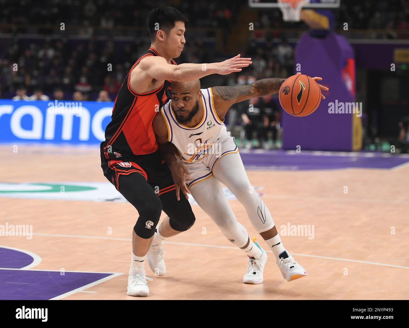 Tianjin, China. 2nd Mar, 2023. Trae Golden (R) of Beijing Royal ...