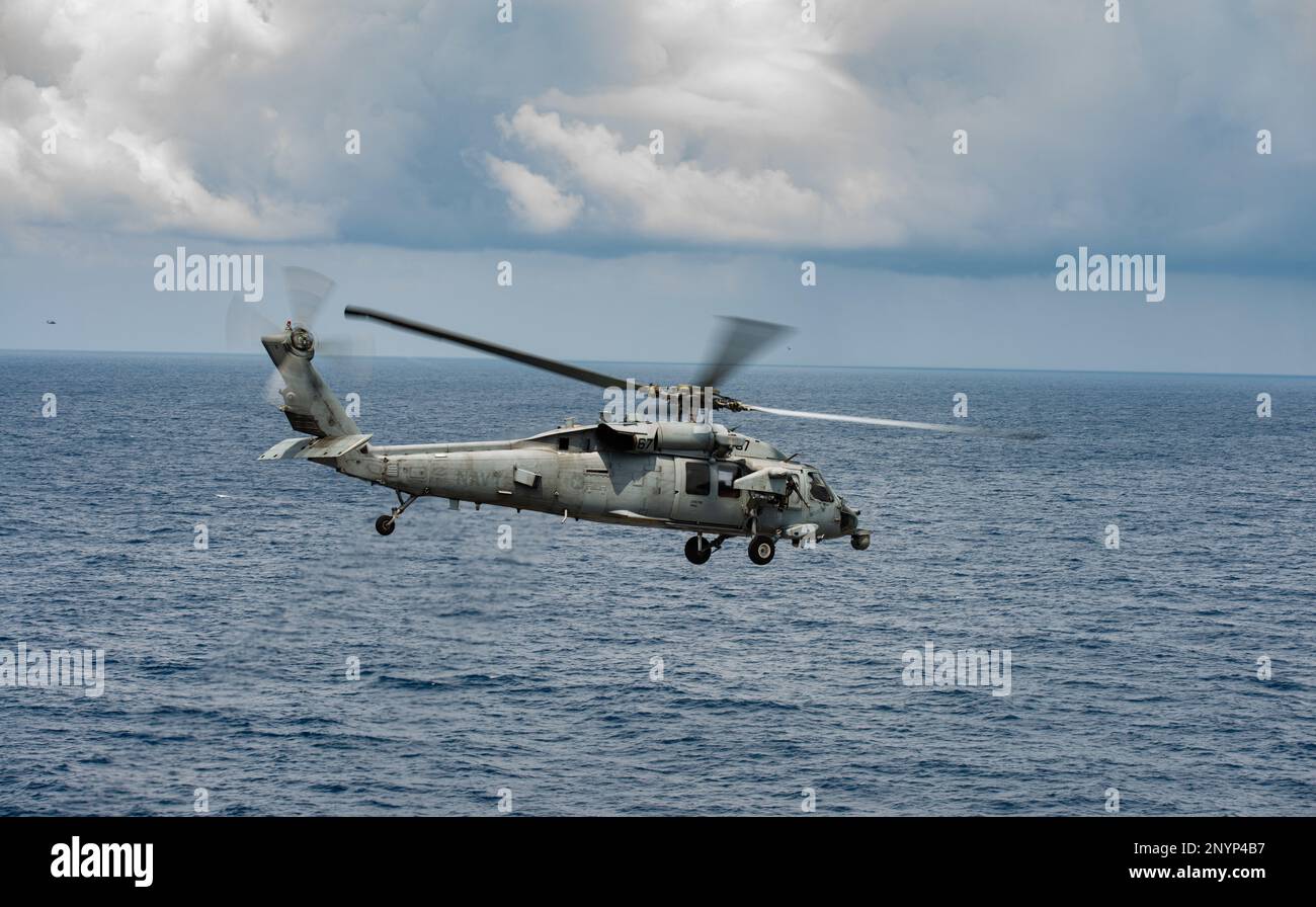 230215-N-WM182-2147 SOUTH CHINA SEA (Feb. 15, 2023) An MH-60S Sea Hawk ...