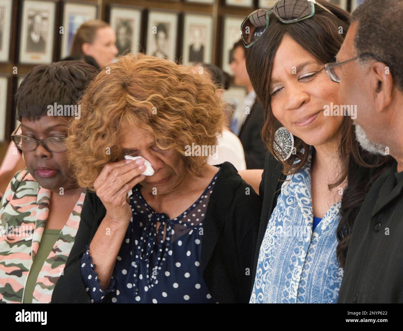 Mabel Miles wipes tears away after a news conference when her son Guy ...