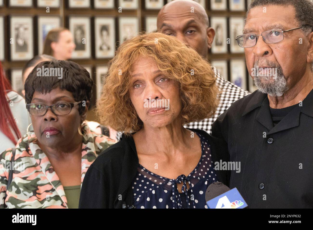 Mabel Miles, center talks with reporters during a news conference after ...